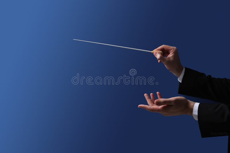 Professional Conductor with Baton on Blue Background, Closeup Stock ...