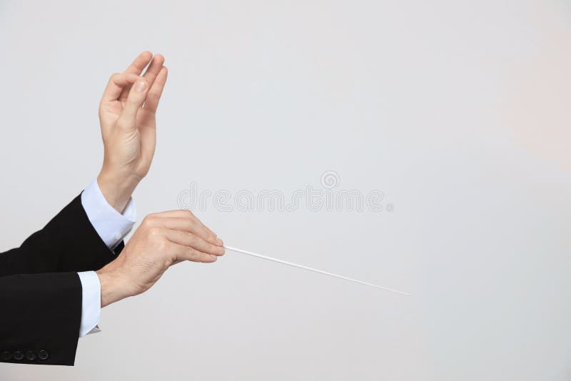 Professional Conductor with Baton on Light Grey Background, Closeup ...