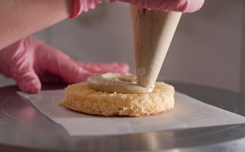 Professional Confectioner Greasing Baked Sponge Cake with Cream. Small ...