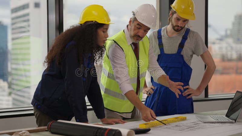 Professional Construction Engineers Team Using Blueprint of Project ...