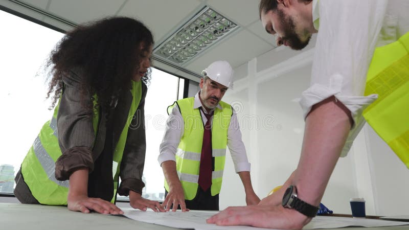 Engineers Using Blueprint of Project Plan Brainstorming and Working ...