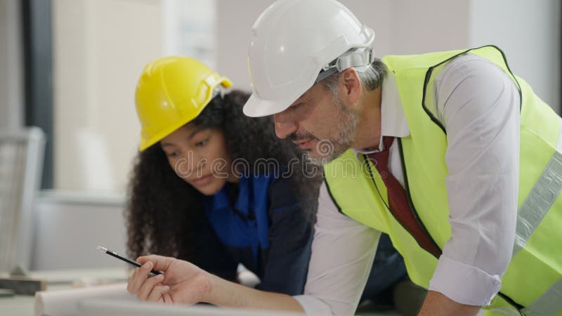 Professional Construction Engineers Team Using Blueprint of Project ...