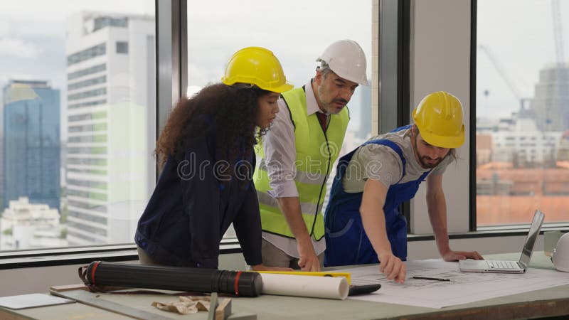 Professional Construction Engineers Team Using Blueprint of Project ...