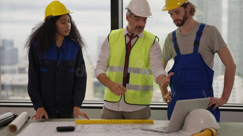 Professional Construction Engineers Team Using Blueprint of Project ...