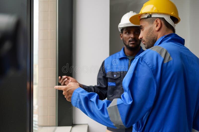 Professional Construction Engineers Team Using Blueprint of Project ...