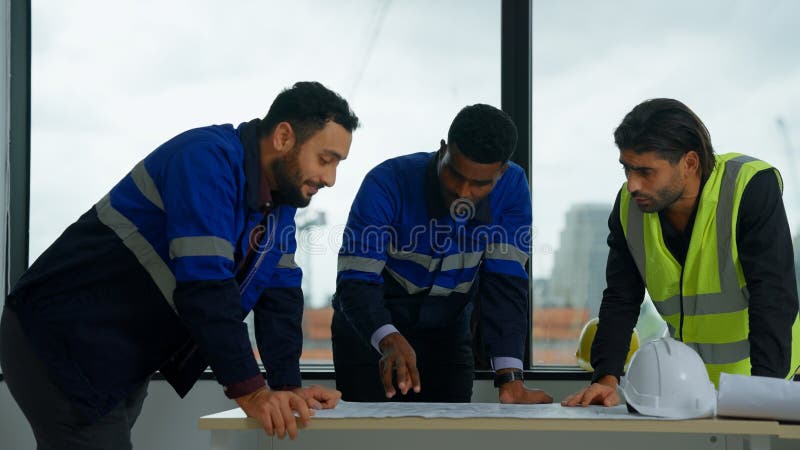 Professional Construction Engineers Using Blueprint Brainstorming Stock ...