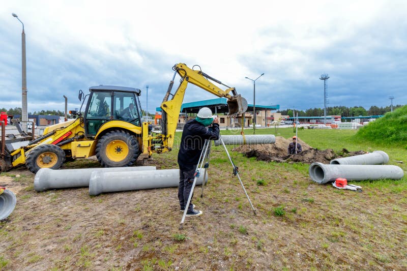 Professional Construction Scene with Excavator and Workers in Action ...