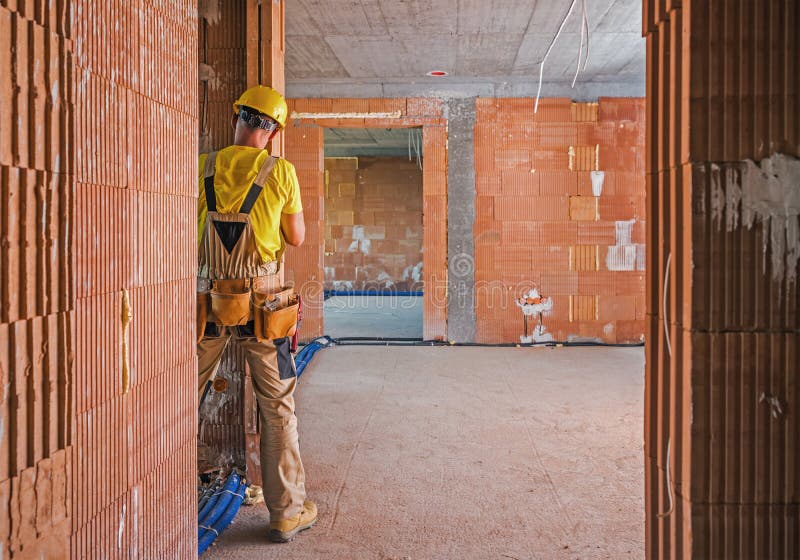 Professional Construction Worker Inside Brick Built Building Stock ...