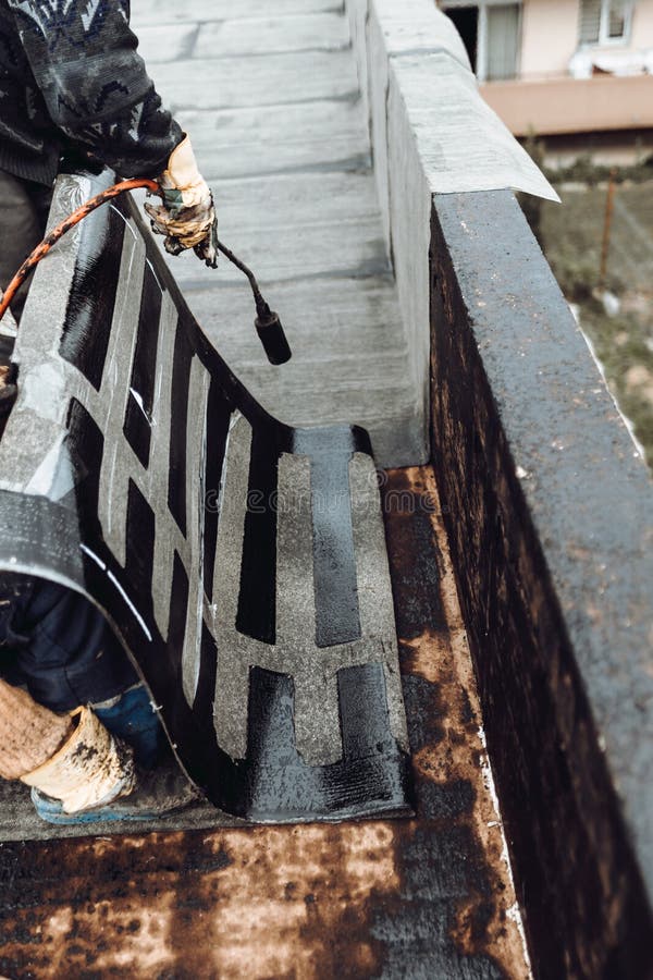 Professional Construction Worker Installing and Waterproofing House ...