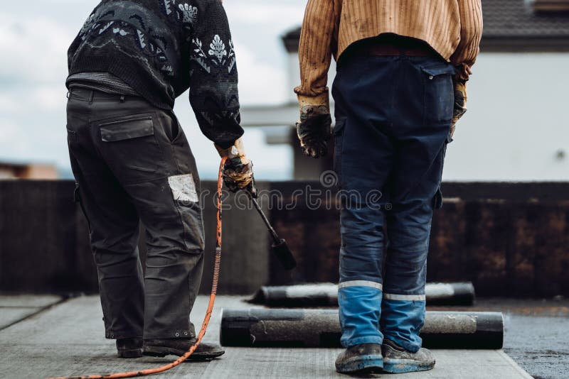 Professional Construction Worker Installing and Waterproofing House ...