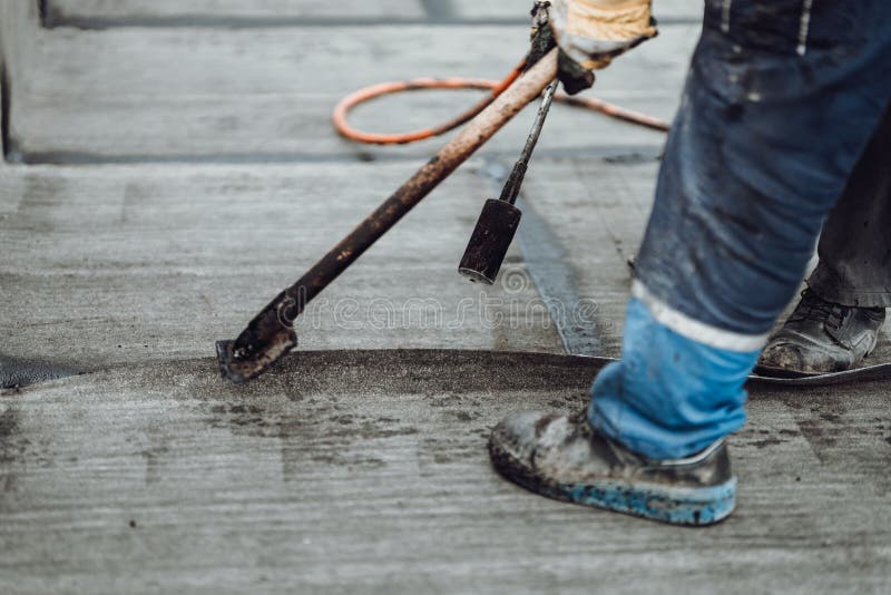 Professional Construction Worker Installing and Waterproofing House ...