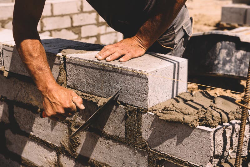Professional Construction Worker Laying Bricks and Mortar - Building ...