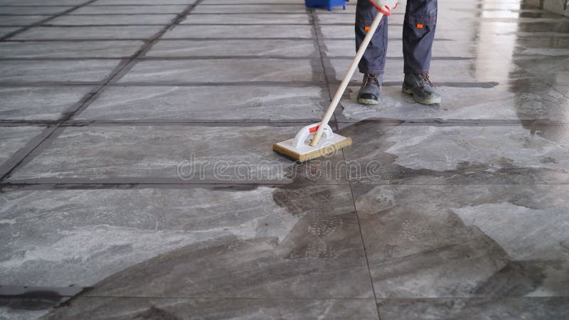 Construction Worker Cleaning Marble Tiles with Sponge and Bucket Stock ...