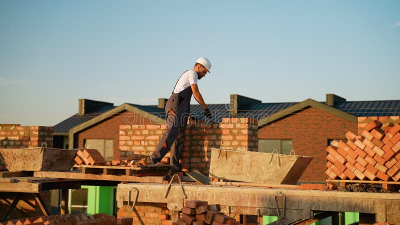 Skilled Worker Laying Bricks at Construction Site Stock Video - Video ...