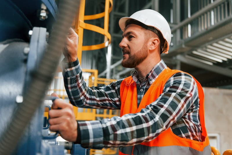 Professional Construction Worker in Uniform is in the Factory Stock ...