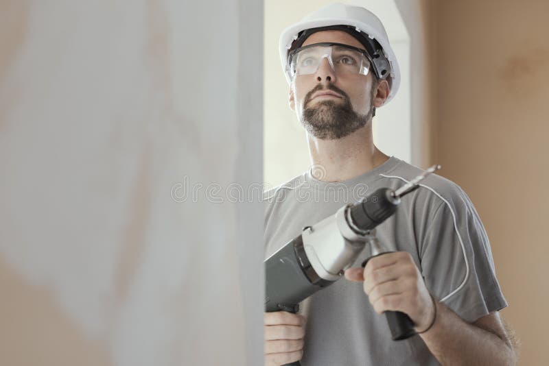 Professional Construction Worker Using a Drill Stock Photo - Image of ...