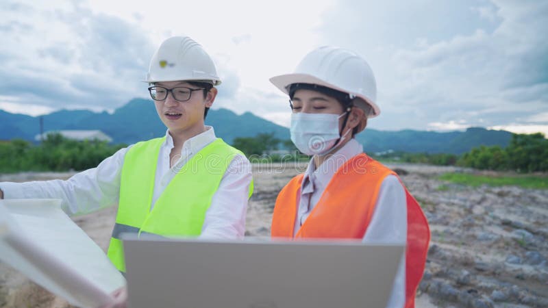 A Professional Constructor Giving a Job Explanation To Young Trainee ...