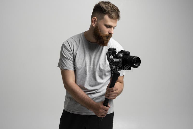 Professional Content Creator with a Dslr Camera on 3-axis Gimbal ...