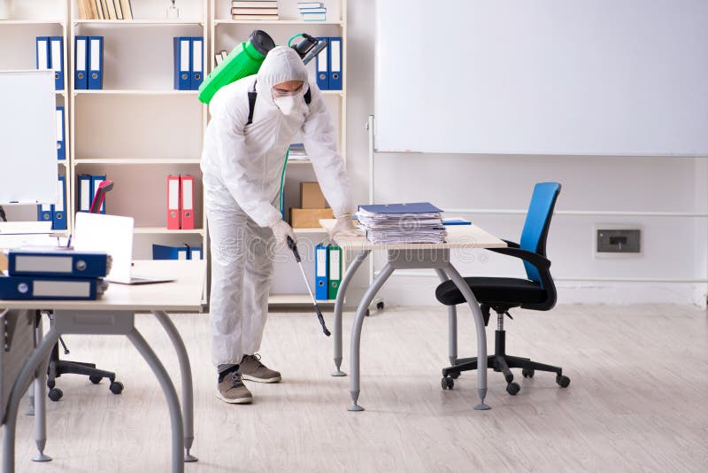 The Professional Contractor Doing Pest Control at Office Stock Photo ...