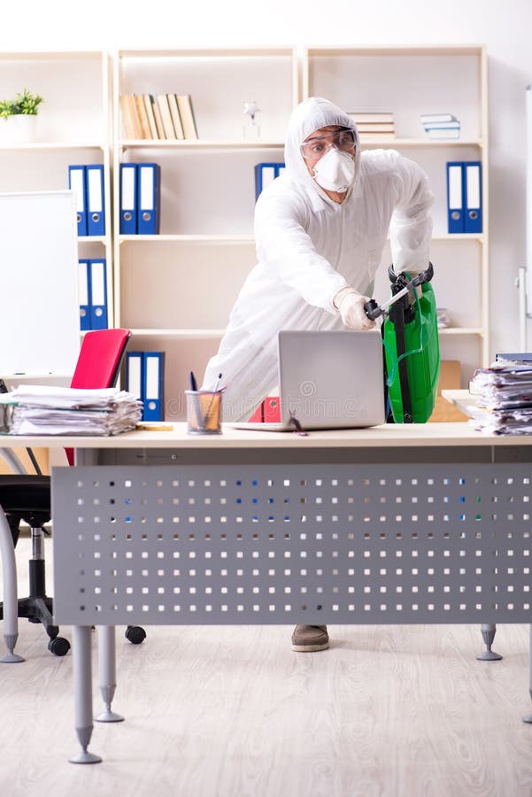 The Professional Contractor Doing Pest Control at Office Stock Photo ...