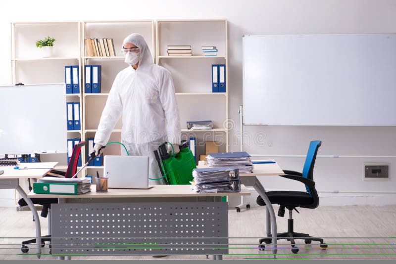 The Professional Contractor Doing Pest Control at Office Stock Photo ...