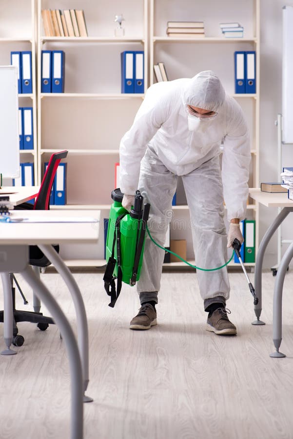 The Professional Contractor Doing Pest Control at Office Stock Photo ...