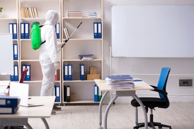 The Professional Contractor Doing Pest Control At Office Stock Photo ...