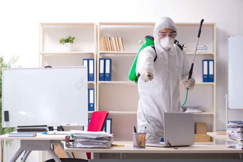 Professional Contractor Doing Pest Control at Office Stock Photo ...