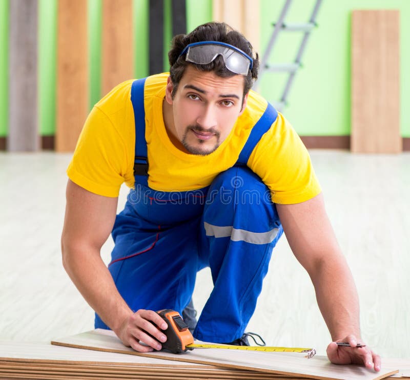 Professional Contractor Laying Flooring at Home Stock Photo - Image of ...