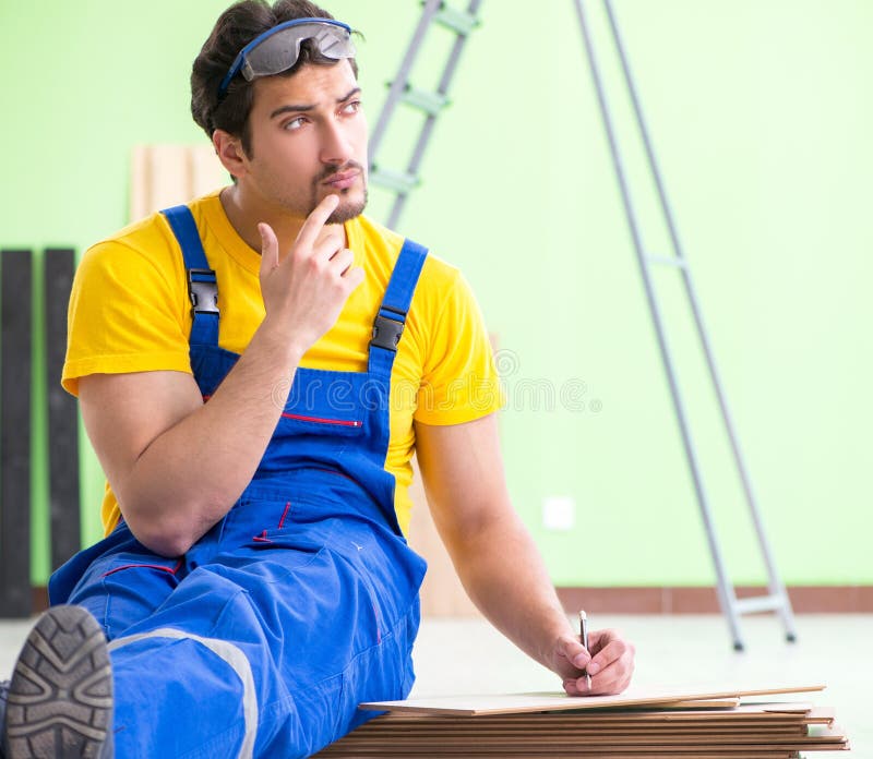 Professional Contractor Laying Flooring at Home Stock Image - Image of ...