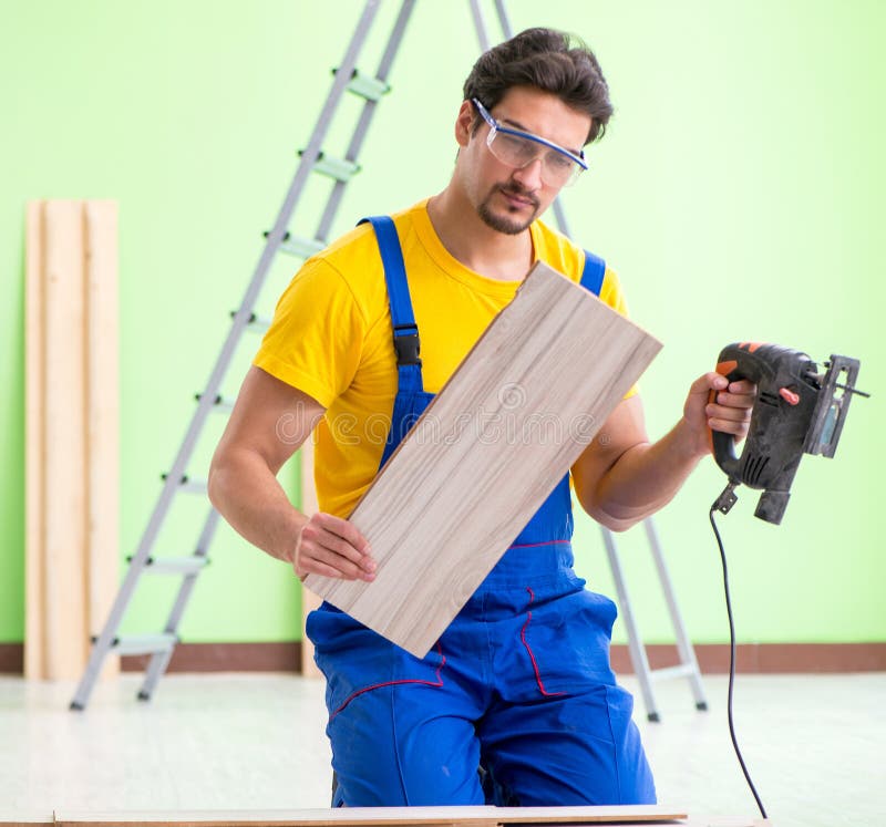 Professional Contractor Laying Flooring at Home Stock Photo - Image of ...