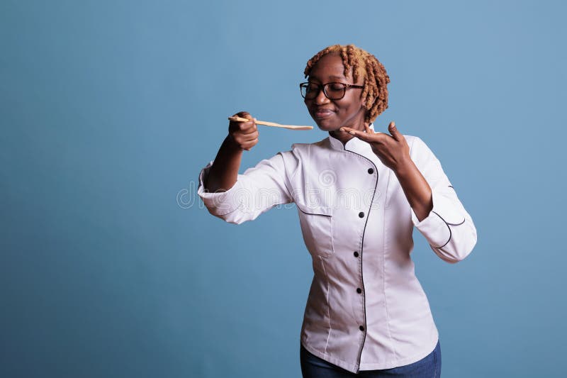 Professional Cook with Kitchen Utensil Posing in Studio Stock Photo ...