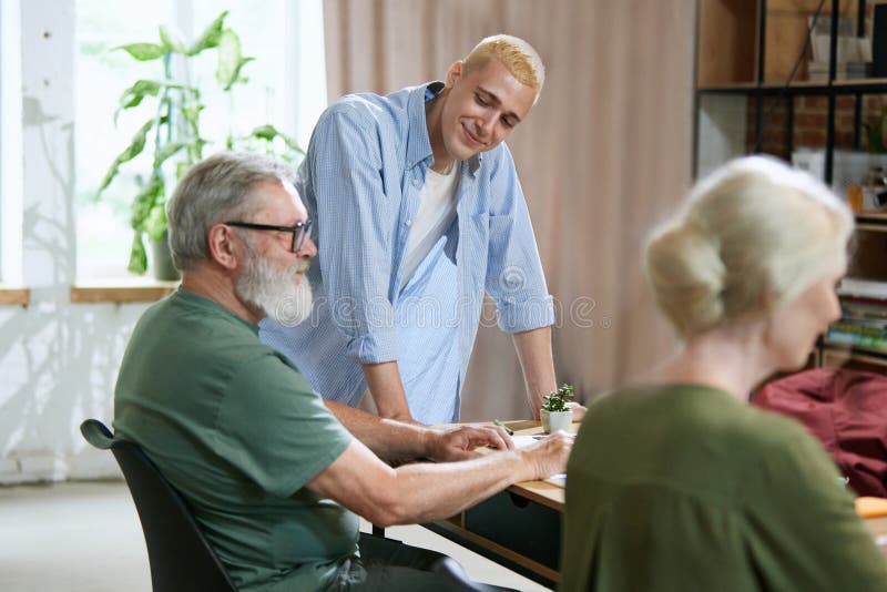 Professional Cooperation among Employees. Young Man and Senior Business ...