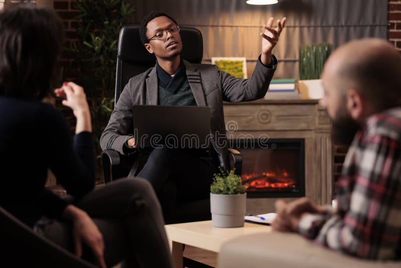 Professional Counselor Explaining Psychological Issues To People Stock ...