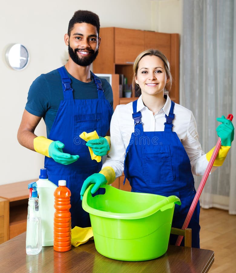 Professional Couple in Uniform Cleaning at Domestic Interior Stock ...