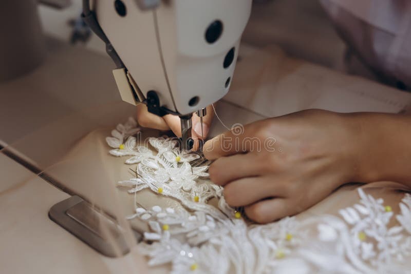 The Professional Crafter is Sewing an Ornament on the Table with the ...