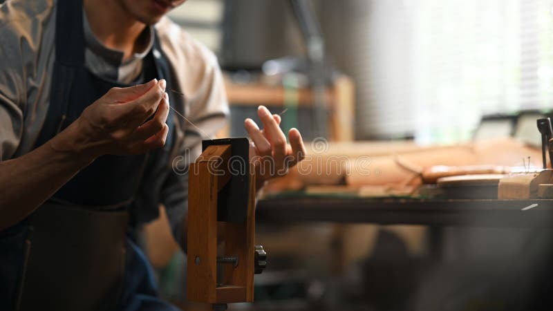 Professional Craftsman in Apron Sewing while Making Handmade Leather ...