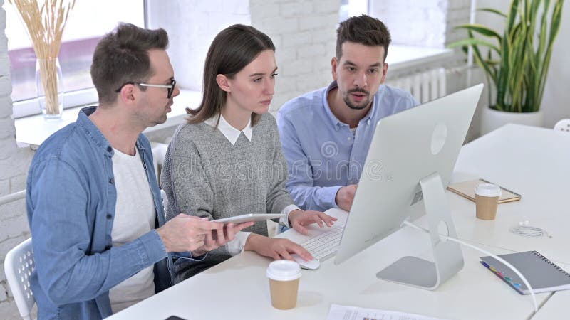 Professional Creative Team Working on Desktop Using Tablet Stock Photo ...