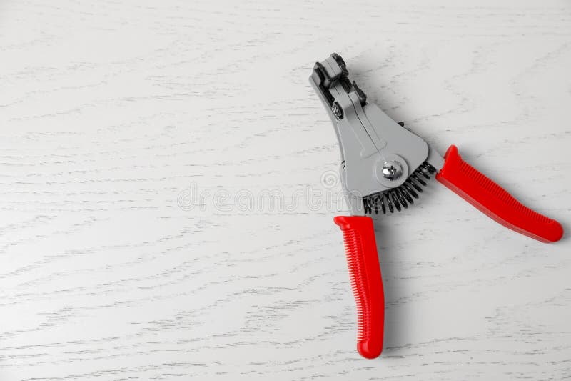Professional Cutters for Wiring on White Wooden Table, Top View. Space ...