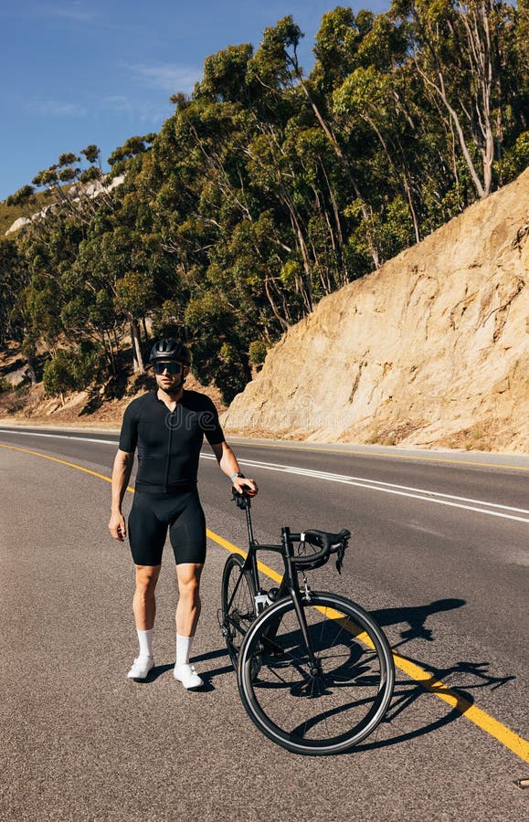 Professional Cyclist with His Road Bike on an Empty Road Stock Photo ...