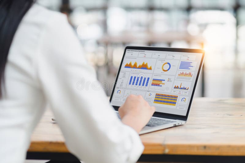 Professional Data Analyst Using Data Visualizations Dashboard on Computer Monitor for Data ...