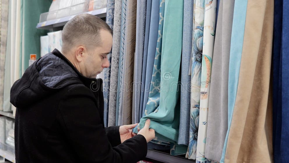Professional Designer Browsing Colorful Textile Samples, Touching ...