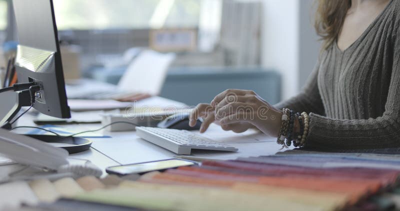 Designer Working with Her Computer in Her Studio Stock Image - Image of ...