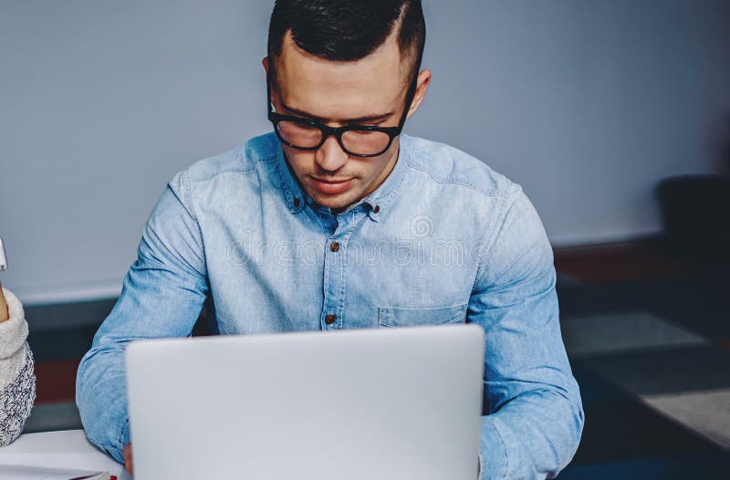 Professional Designers Collaborating on Common Project Sitting at ...