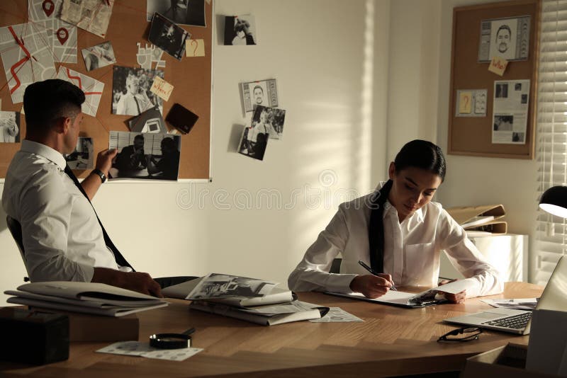 Professional Detectives Working at Desk in Office Stock Image - Image ...