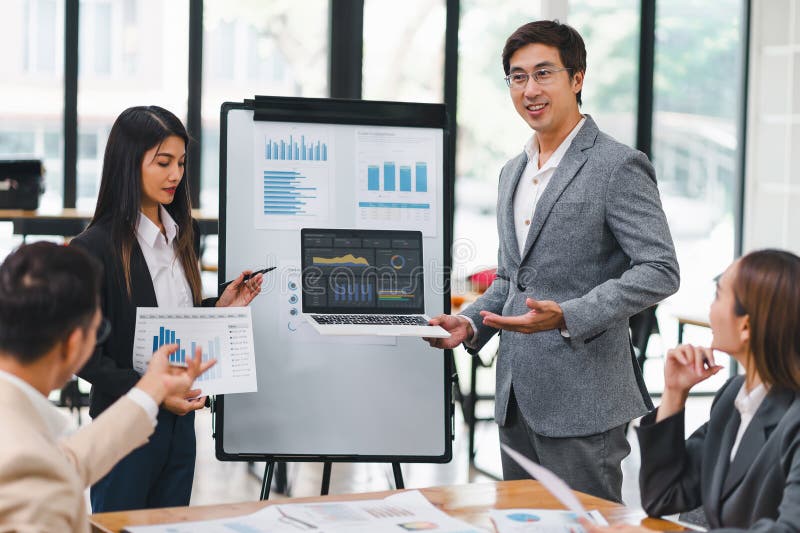 Professional Diverse Business Team Presenting and Discussing Data Charts and Graphs during ...