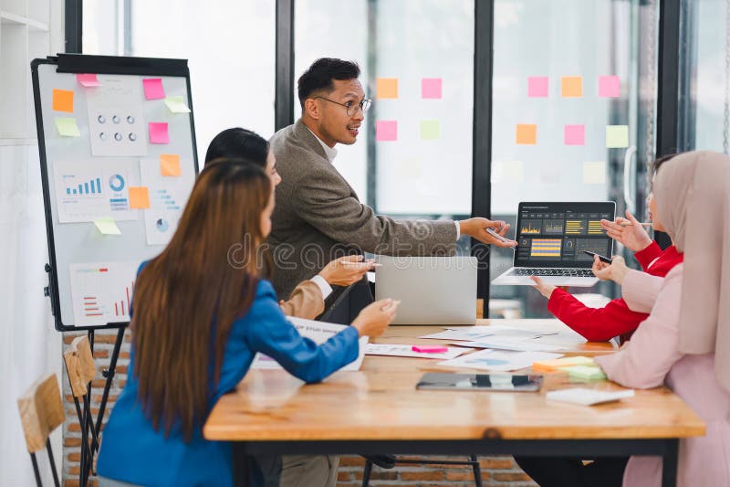 Professional Diverse Business Team Presenting and Discussing Data ...