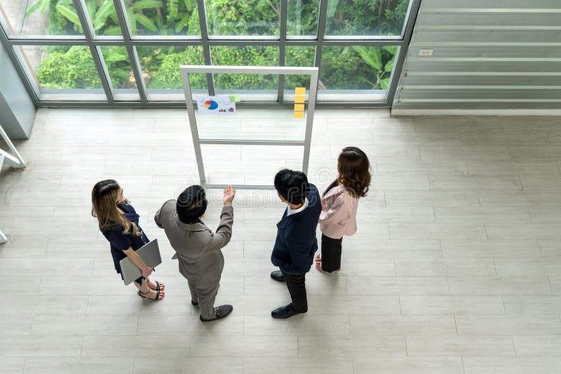 Professional and Diverse Business Team Standing Confidently in Front of ...