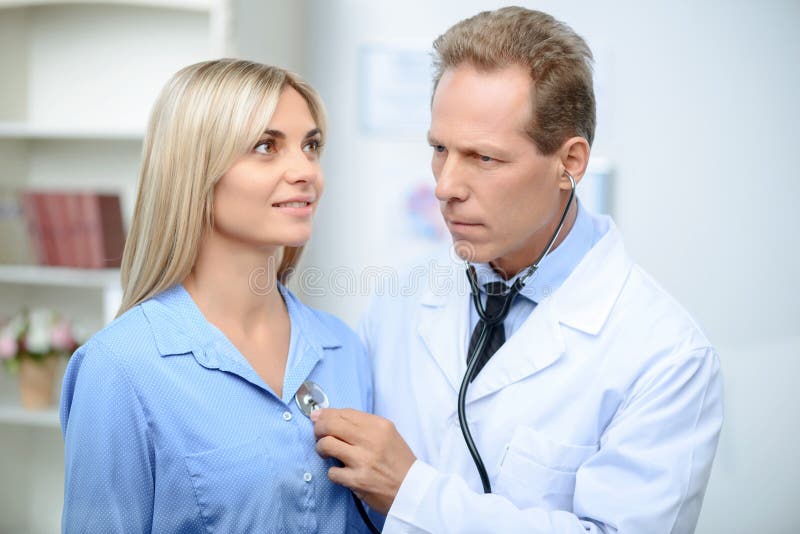 Professional Doctor Examining His Patient Stock Image - Image of ...