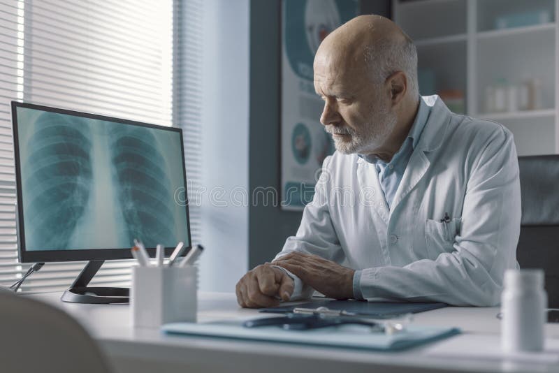 Doctor Analyzing an X-ray Image on the Computer Screen Stock Photo ...